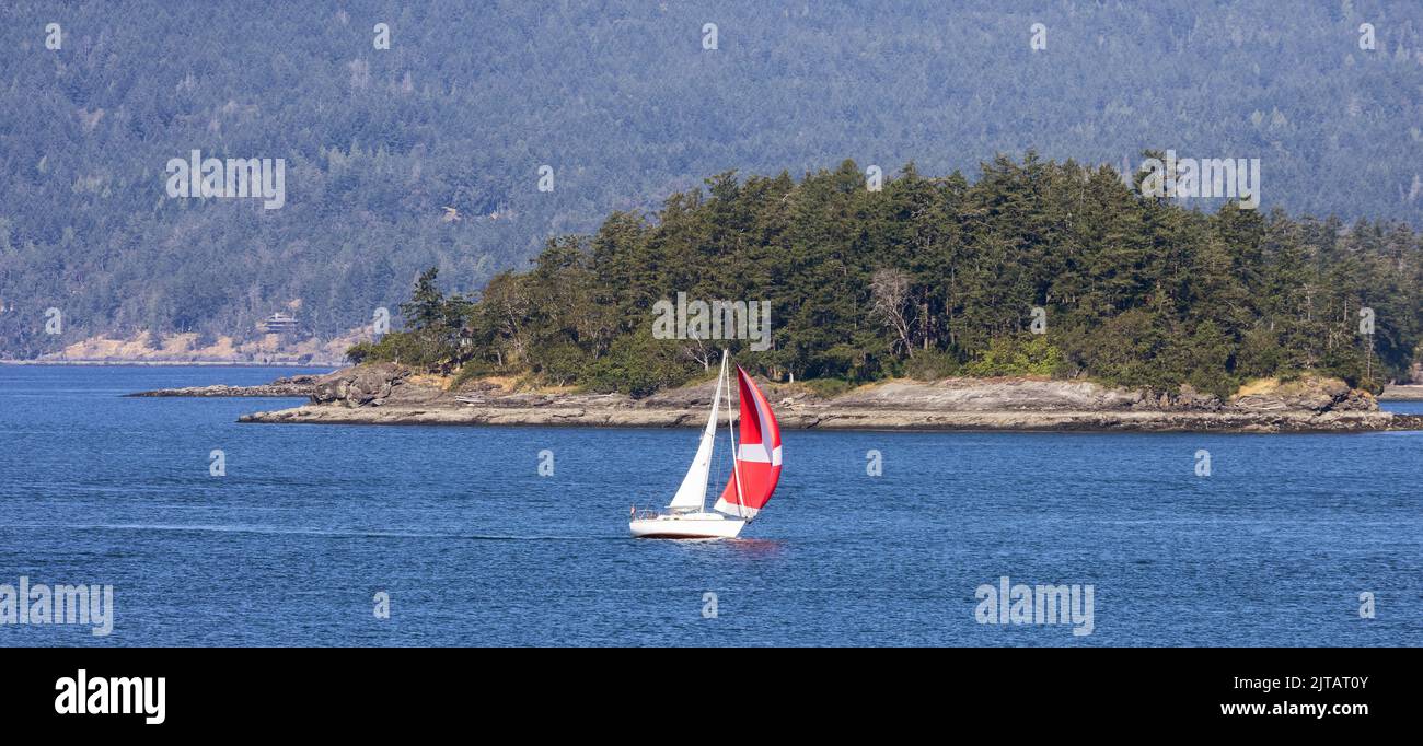 Sailboat in Canadian Landscape by the ocean and mountains Stock Photo ...