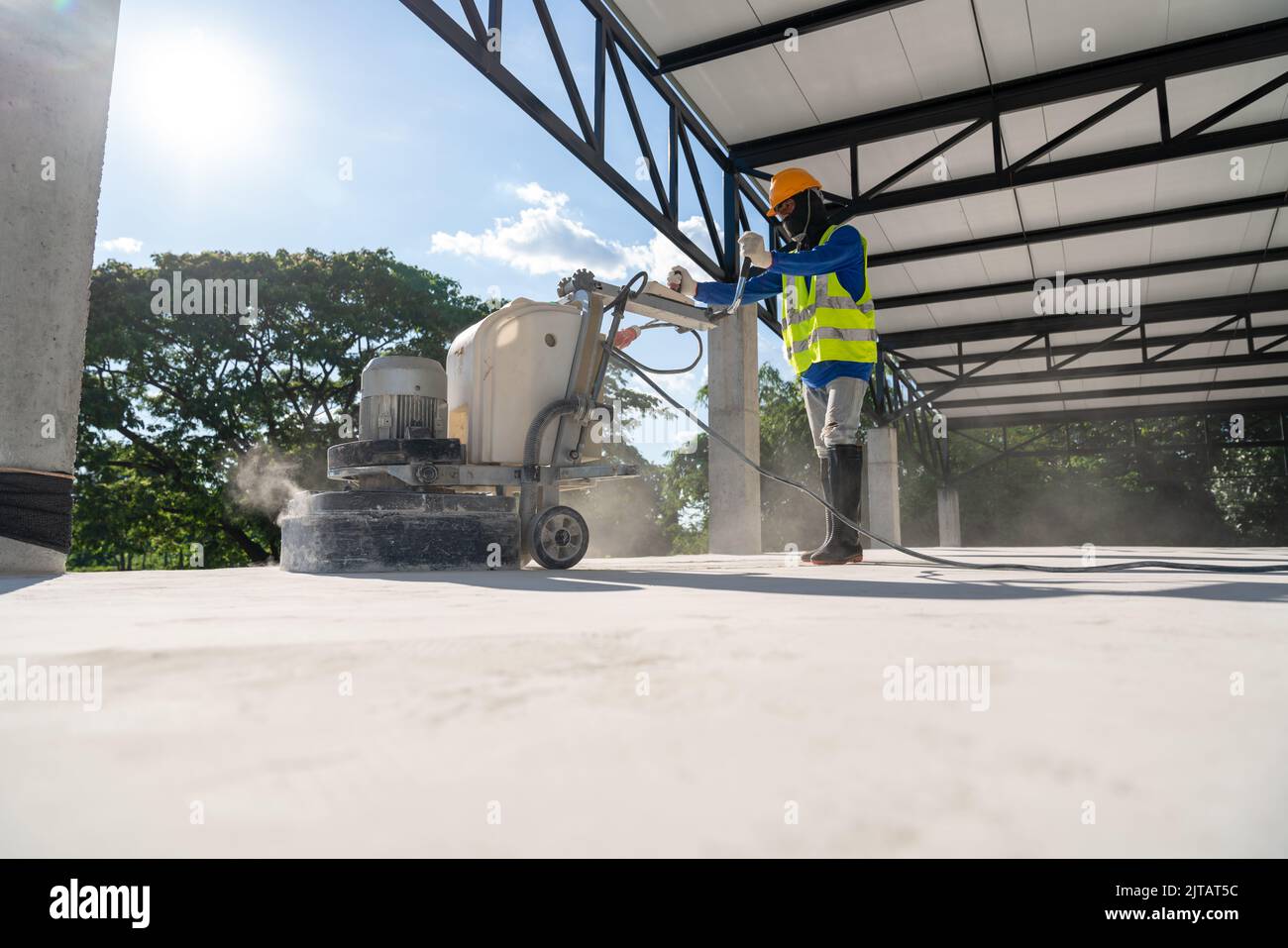 Construction Worker Using Machine Polishing Surface Floor Smoothing And