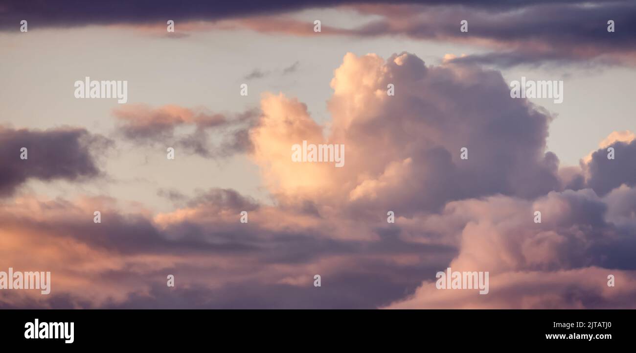Puff Clouds in the Sky during sunset. Zoom in Stock Photo - Alamy