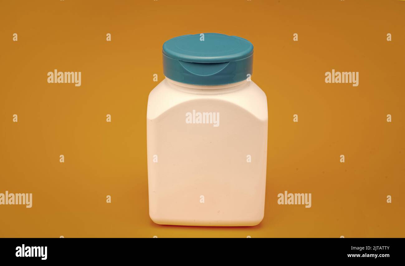 multivitamin bottle on yellow background. food supplement Stock Photo ...