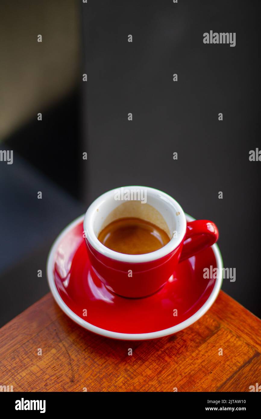 A cup espresso in red small glass Stock Photo - Alamy