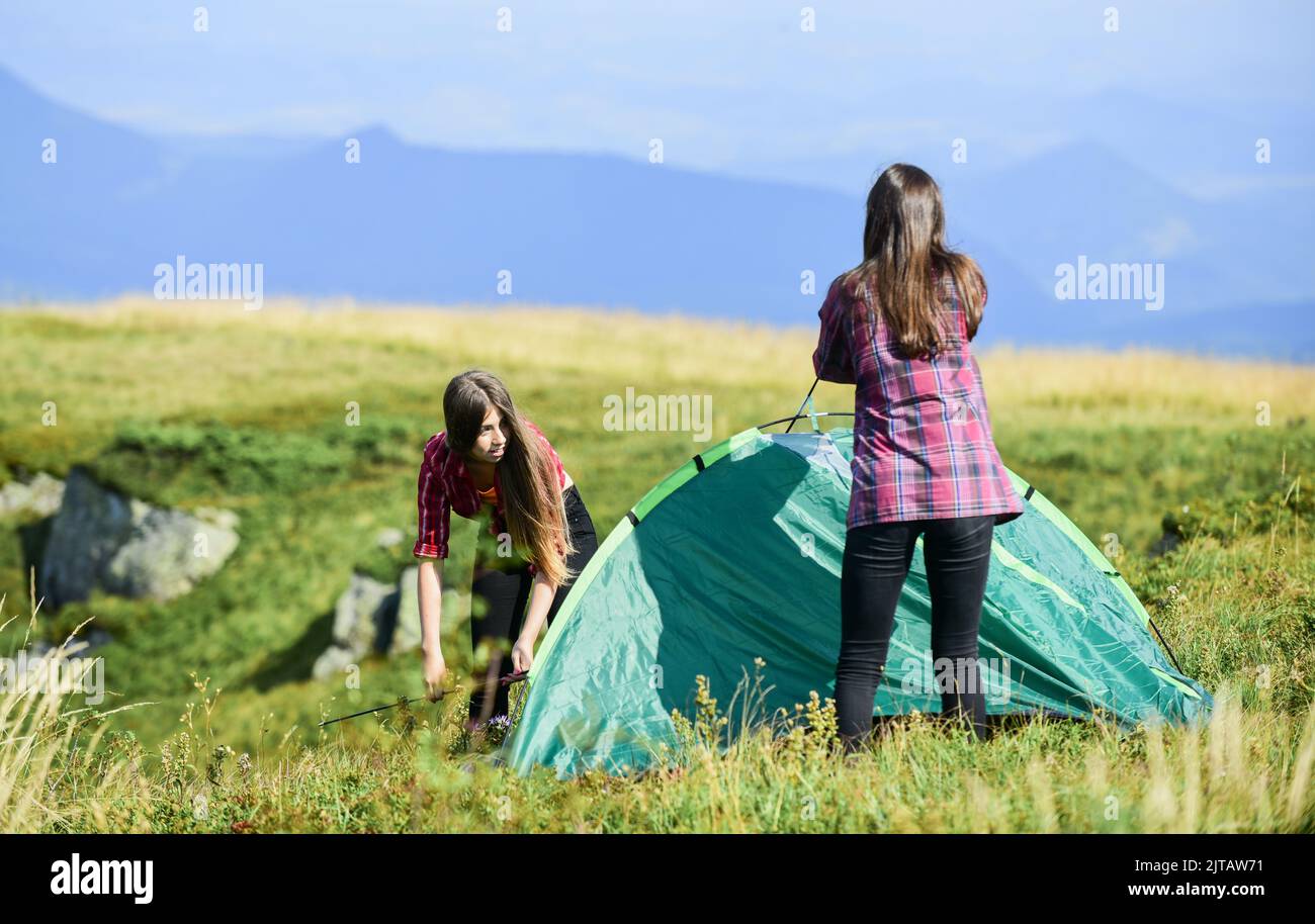 Helpful to have partner for raising tent. Attach necessary structural ...