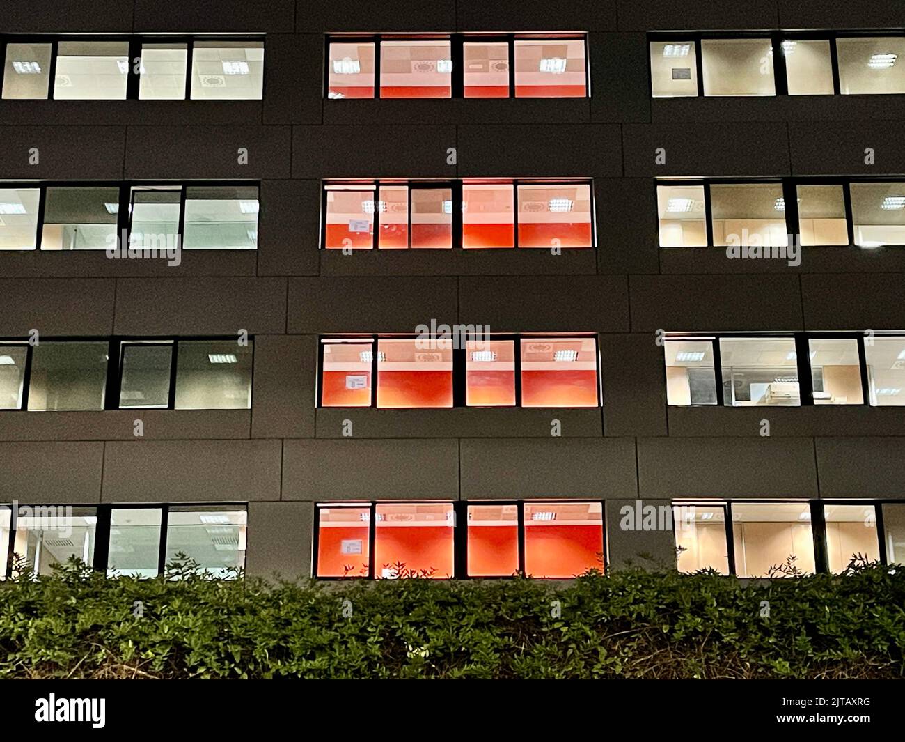 An illuminated office building at night in Madrid Las Tablas Stock ...