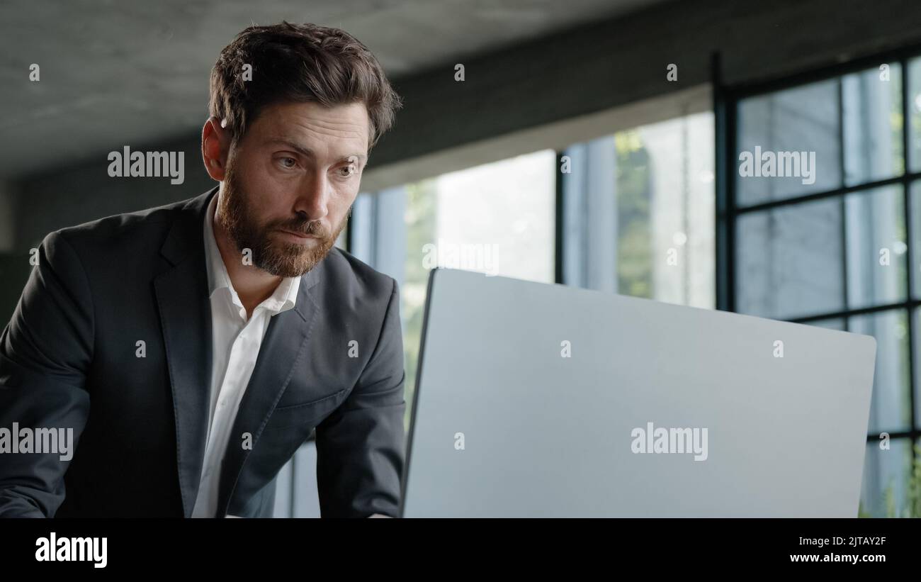 Serious 40s bearded businessman entrepreneur employee standing in ...