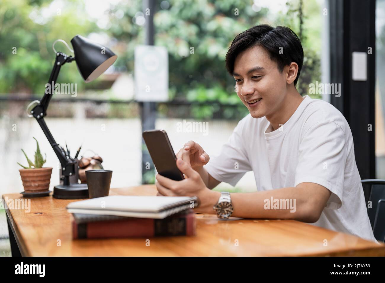 Asian man with mobile phone hi-res stock photography and images - Alamy