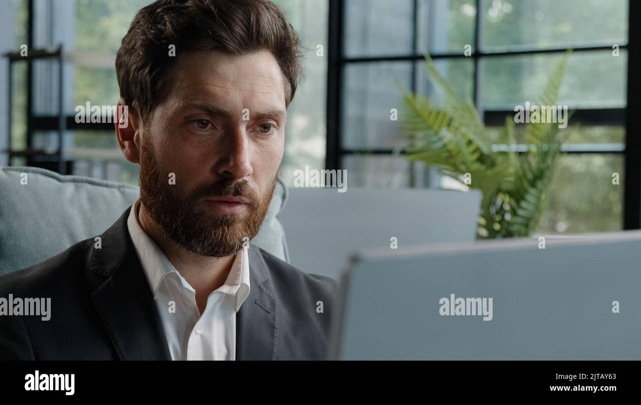 Close up caucasian bearded middle aged 40s freelancer man worker user ...