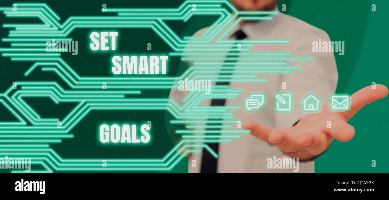 Hand writing sign Set Smart Goals. Word for Establish achievable ...