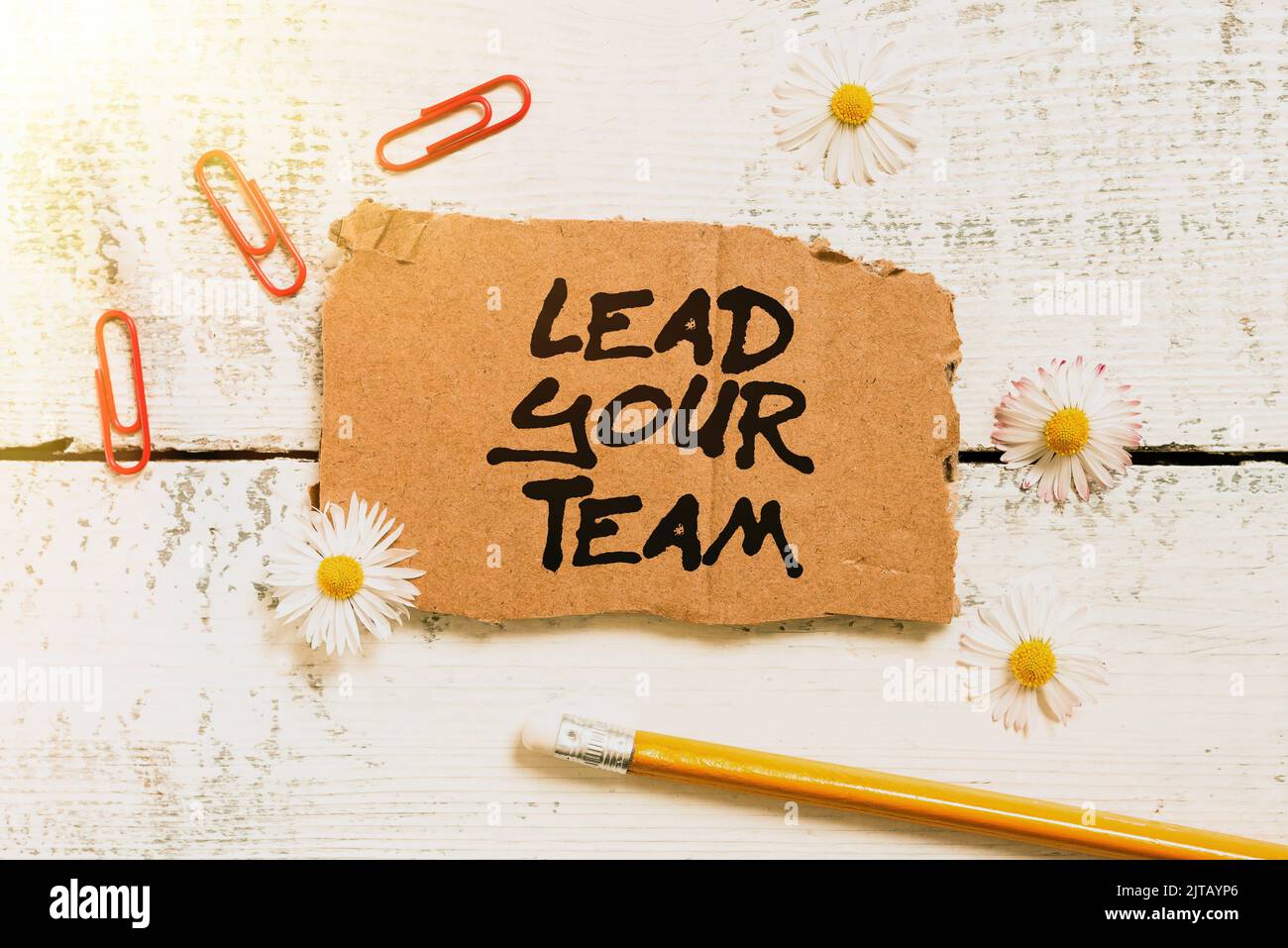 Hand writing sign Lead Your Team. Word for Be a good leader to obtain ...