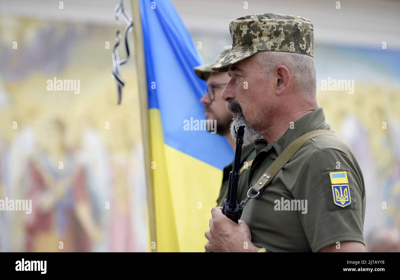 KYIV, UKRAINE - AUGUST 28, 2022 - Servicemen stand to attention during ...