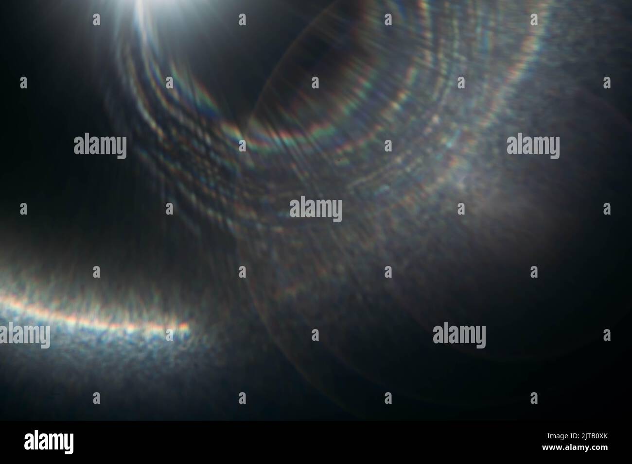blur rainbow lens flare dark background spotlight Stock Photo - Alamy