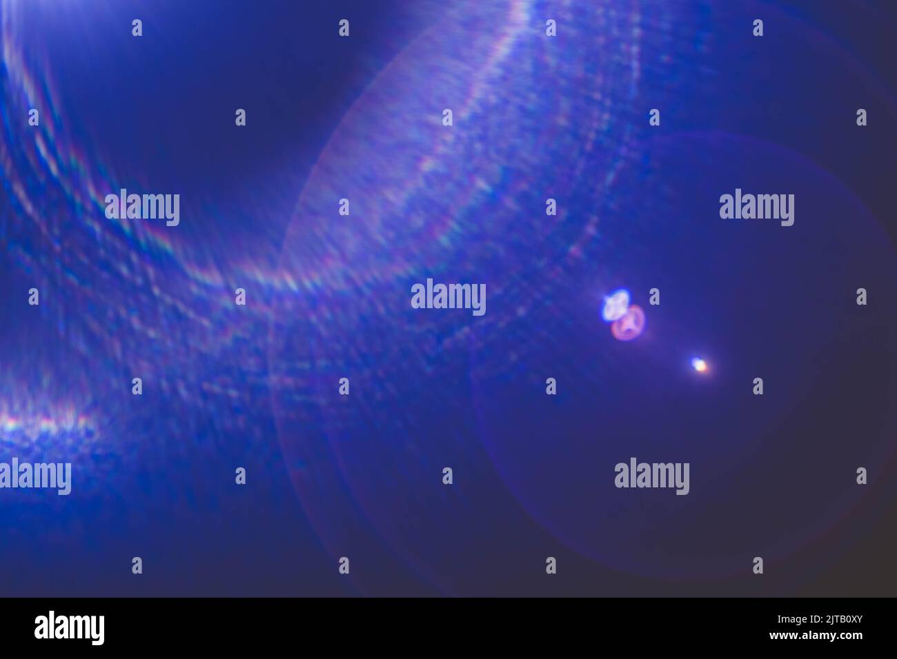 blur rainbow lens flare blue background spotlight Stock Photo - Alamy