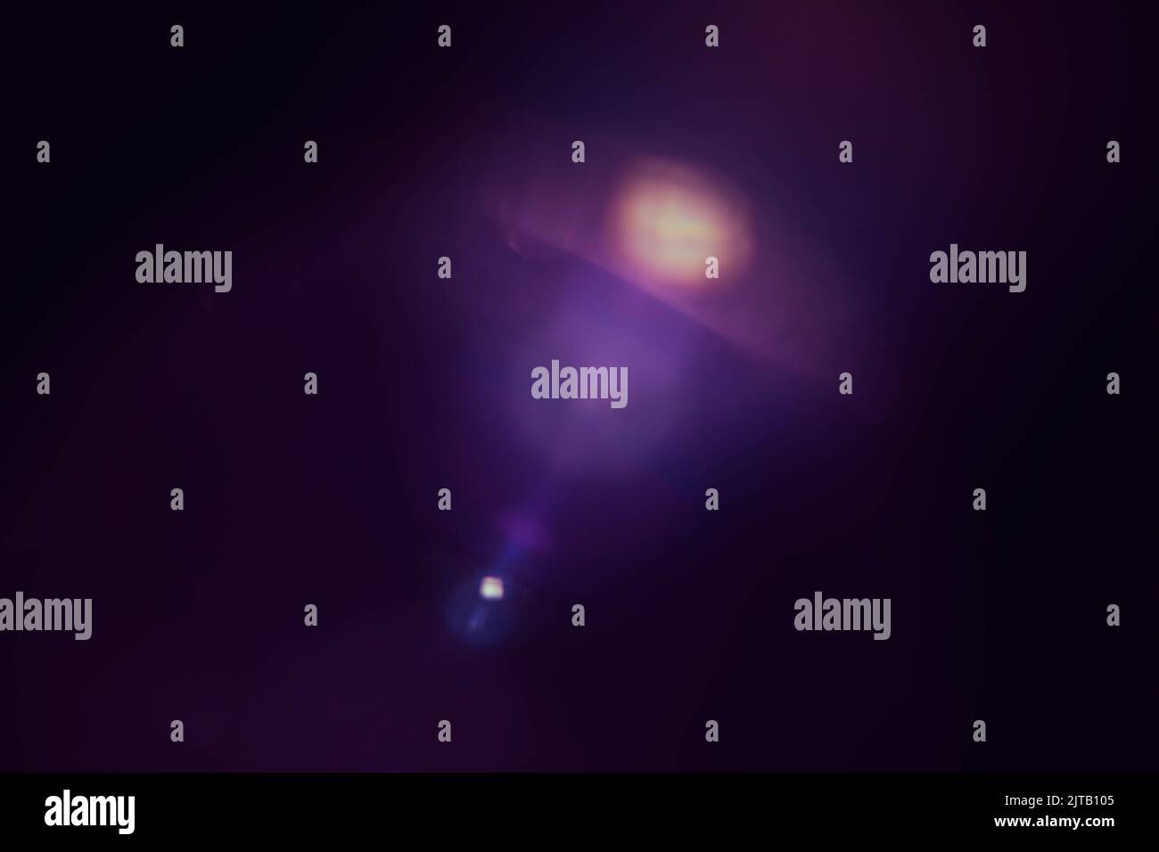 blur lens flare purple background light dots Stock Photo - Alamy