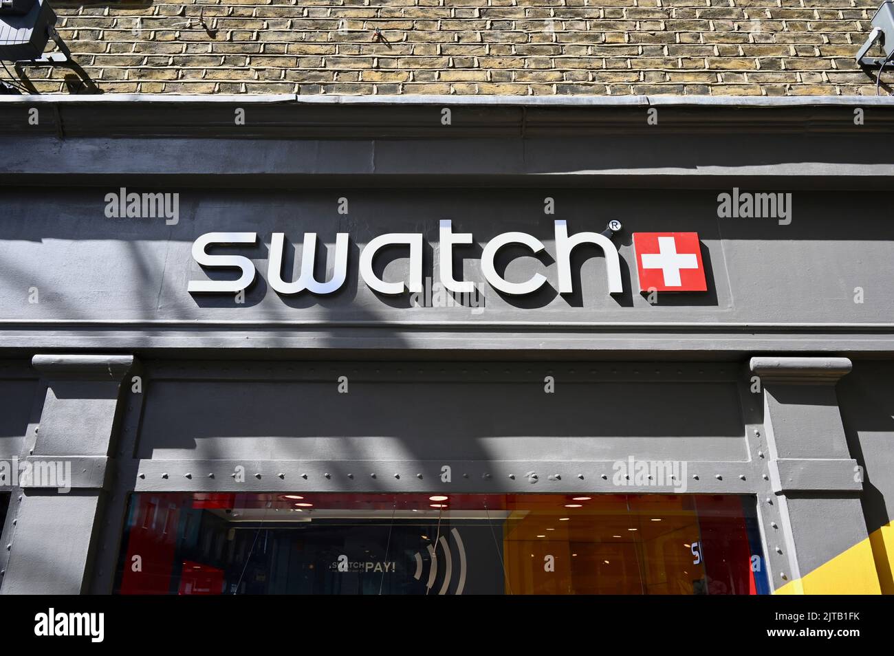 Swatch Logo, Carnaby Street, Westminster, London, UK Stock Photo - Alamy