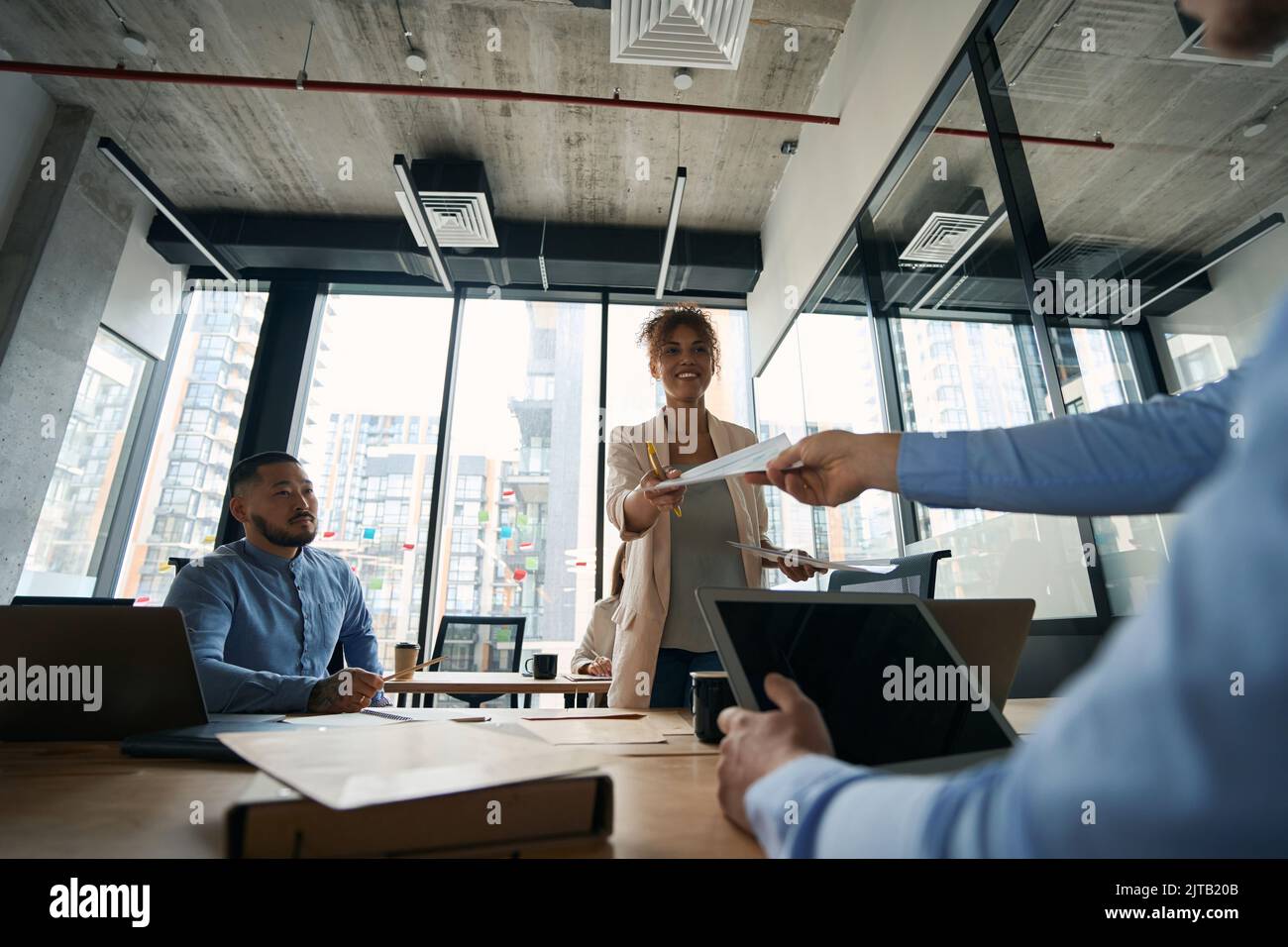Handing document woman in hi-res stock photography and images - Alamy
