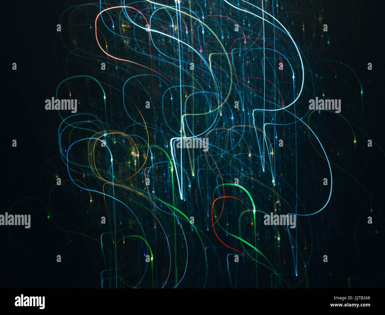 neon yellow blue pink swirly lines sparks rays Stock Photo - Alamy