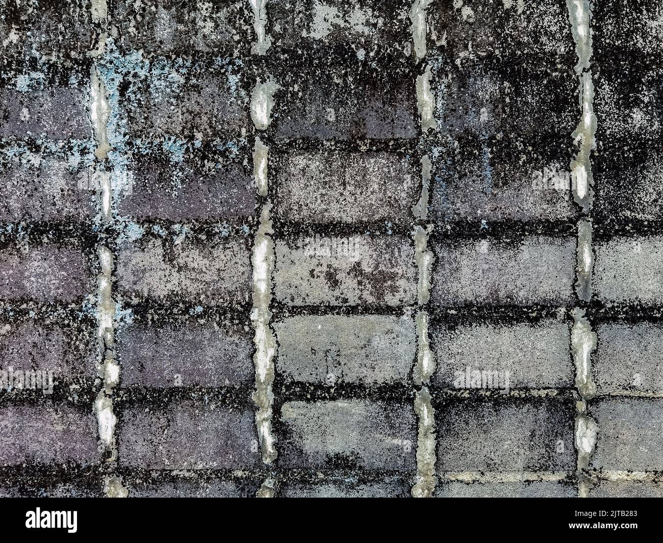 Dirty old eroded cracked plaster cement block fence. Concrete block ...