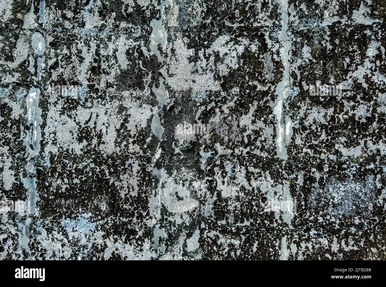 Dirty old eroded cracked plaster cement block fence. Concrete block ...