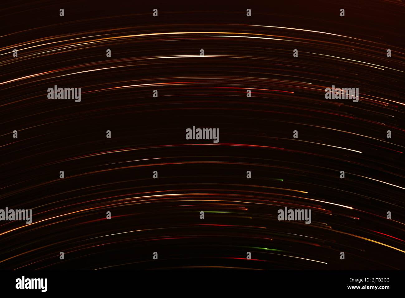 orange arc lines lights motion brown background Stock Photo - Alamy