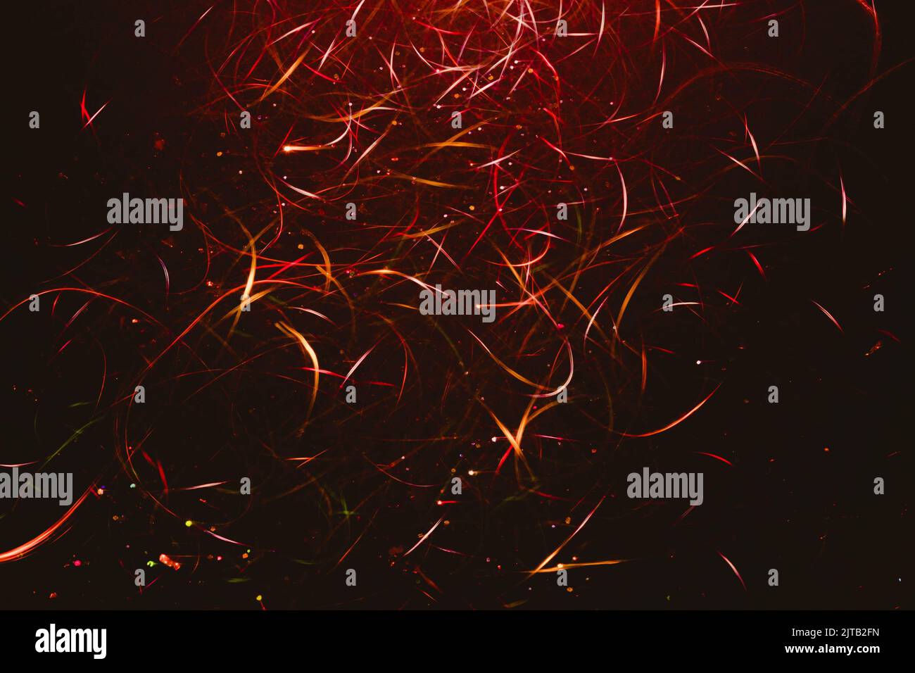 red orange sparkles illuminated curvy lines dots Stock Photo - Alamy