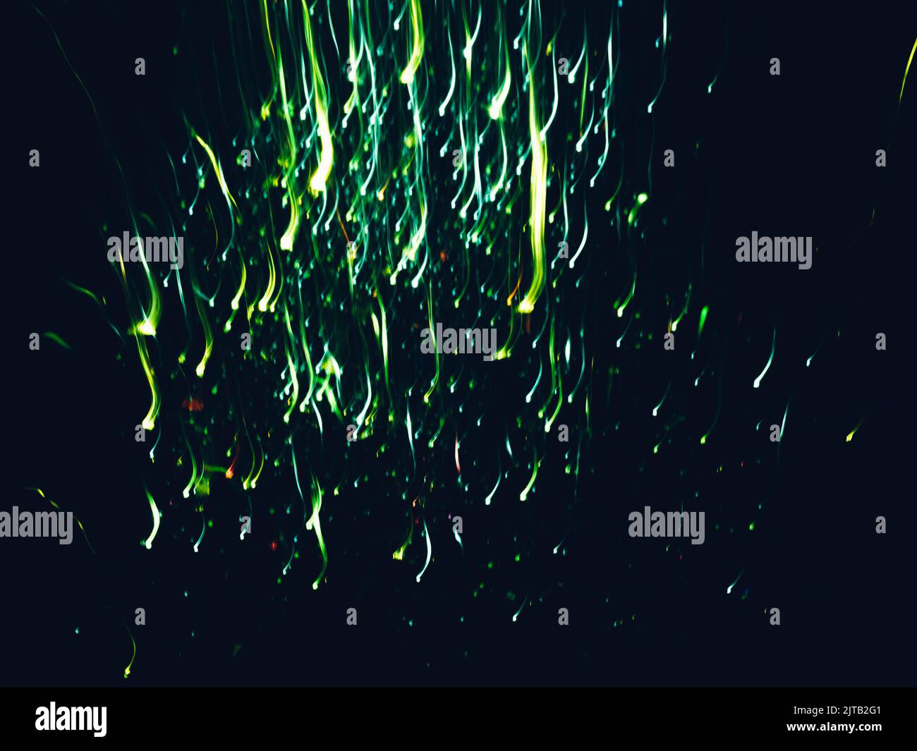 neon green lights falling firework sparkles lines Stock Photo - Alamy