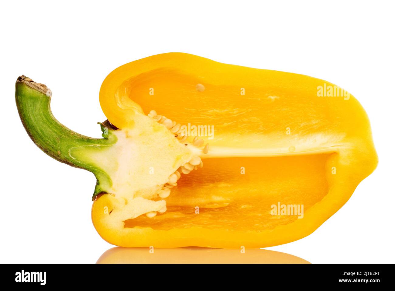 One half of bright yellow, organic ripe juicy bell pepper, close-up, on ...