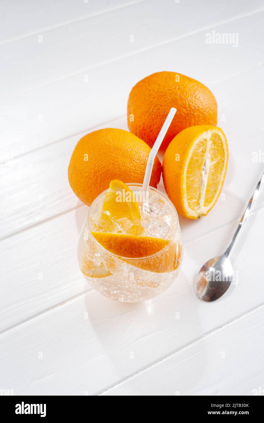 Cold fresh orange lemonade on wooden light background Stock Photo - Alamy