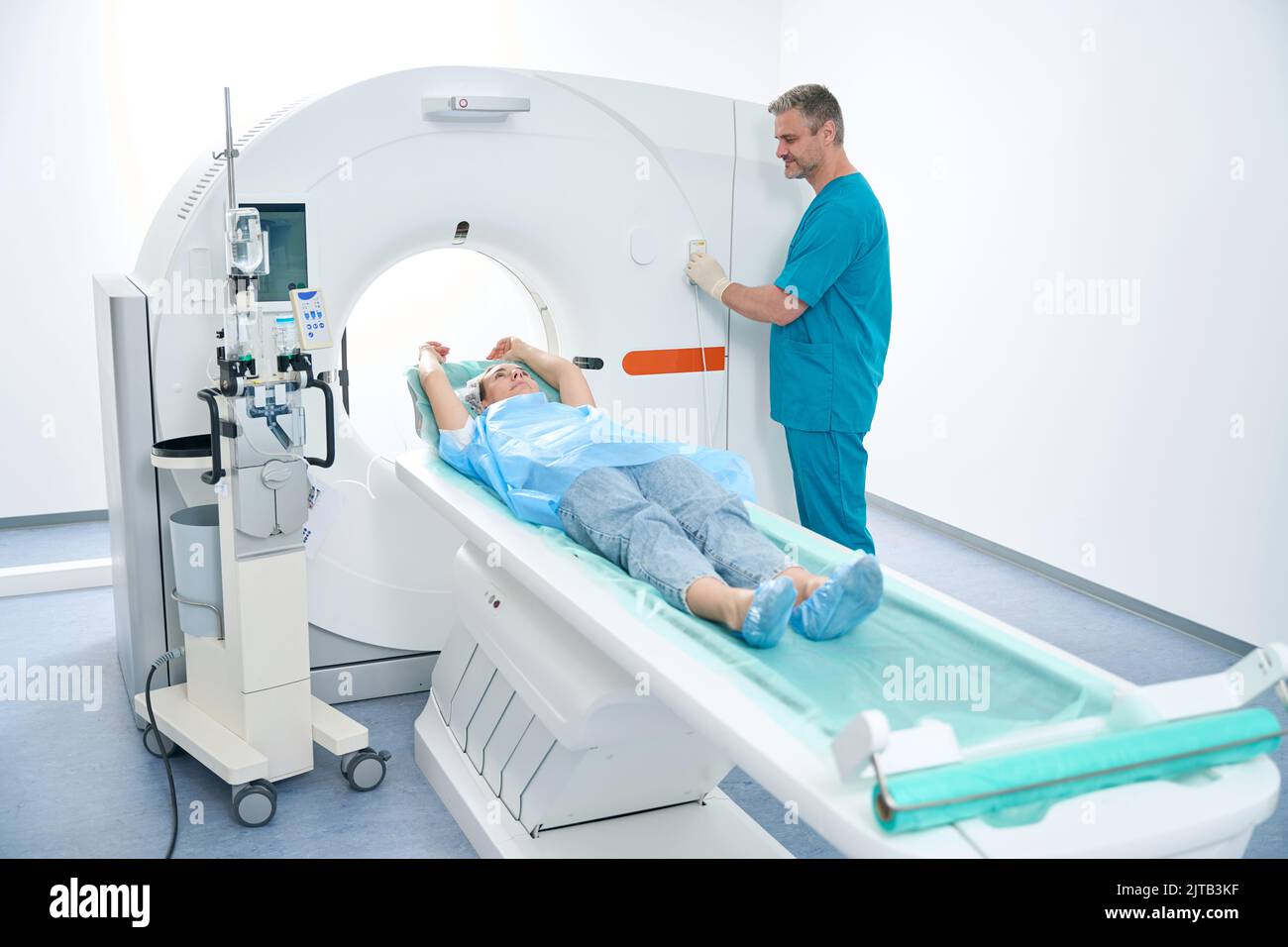 Doctor and woman patient during CT scan at medical center Stock Photo ...