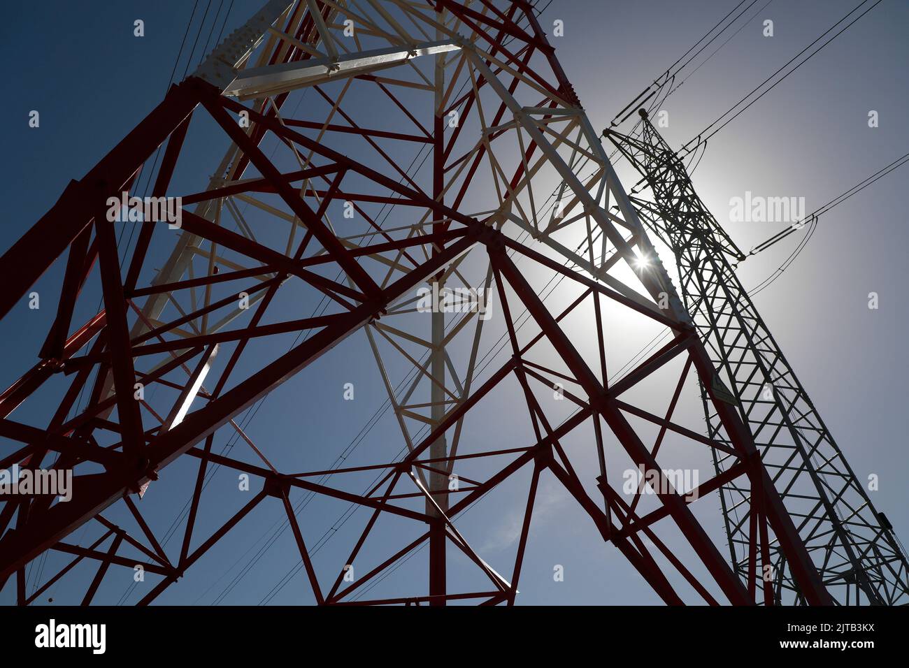 Palma, Spain. 29th Aug, 2022. The sun shines through high-voltage ...