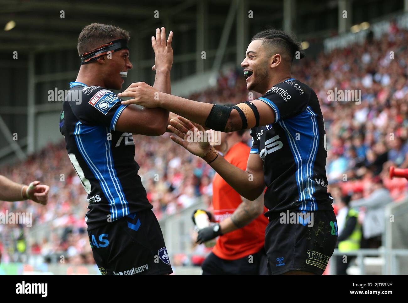 Wakefield Trinity's Lewis Murphy (right) celebrates with Corey Hall ...