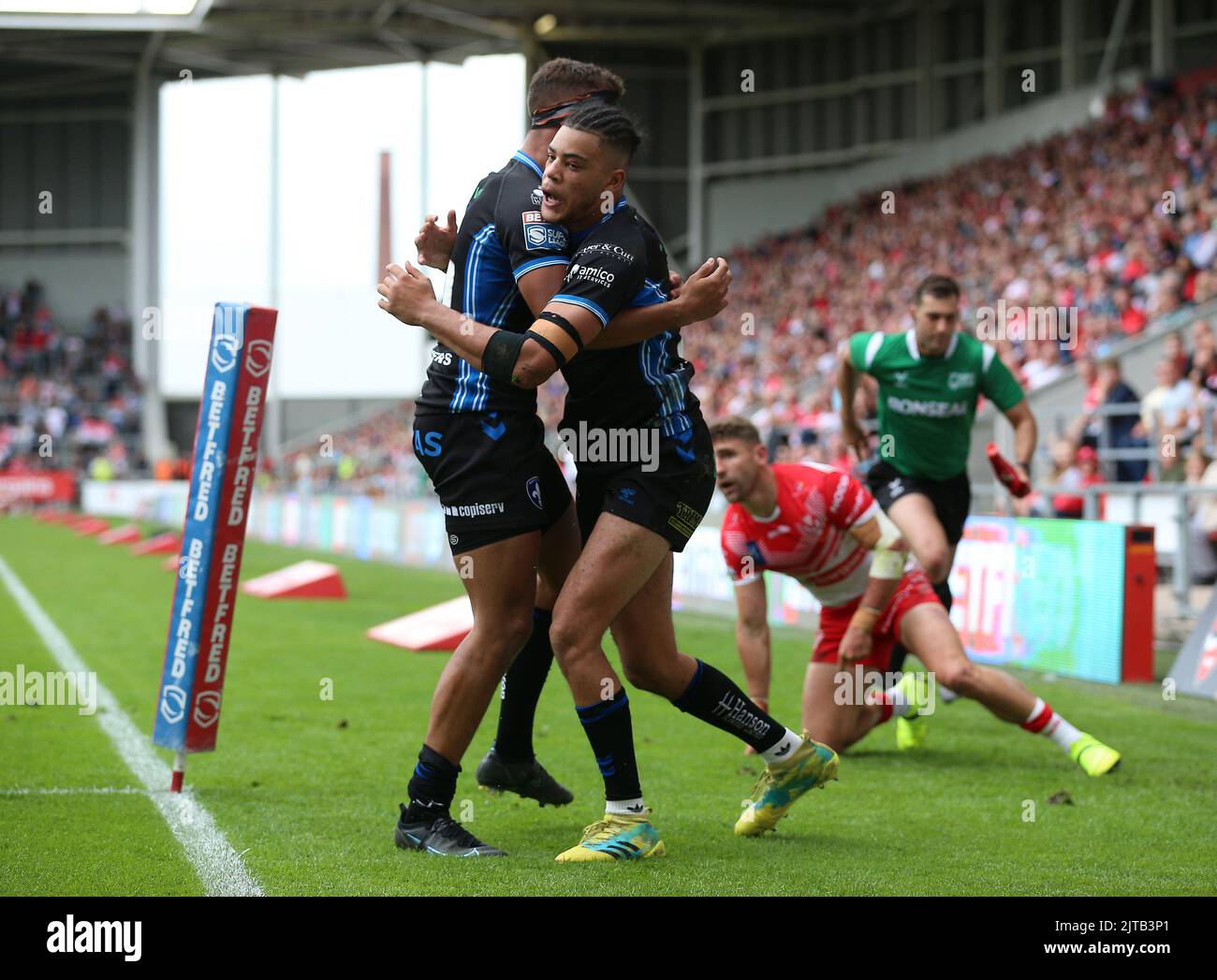 Wakefield Trinity's Lewis Murphy (right) celebrates with Corey Hall ...