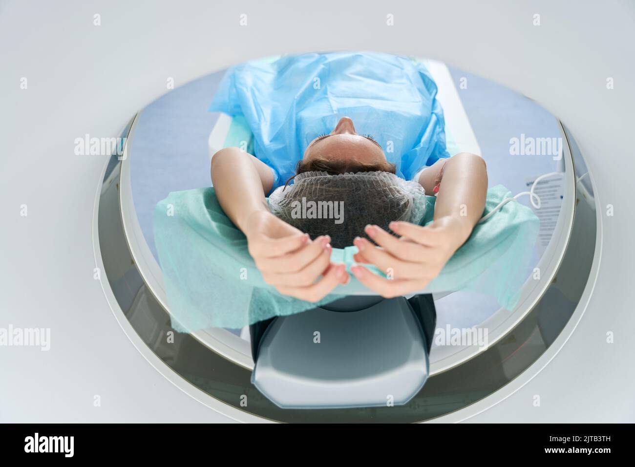 Patient is placed in the tomography chamber for computed tomography ...