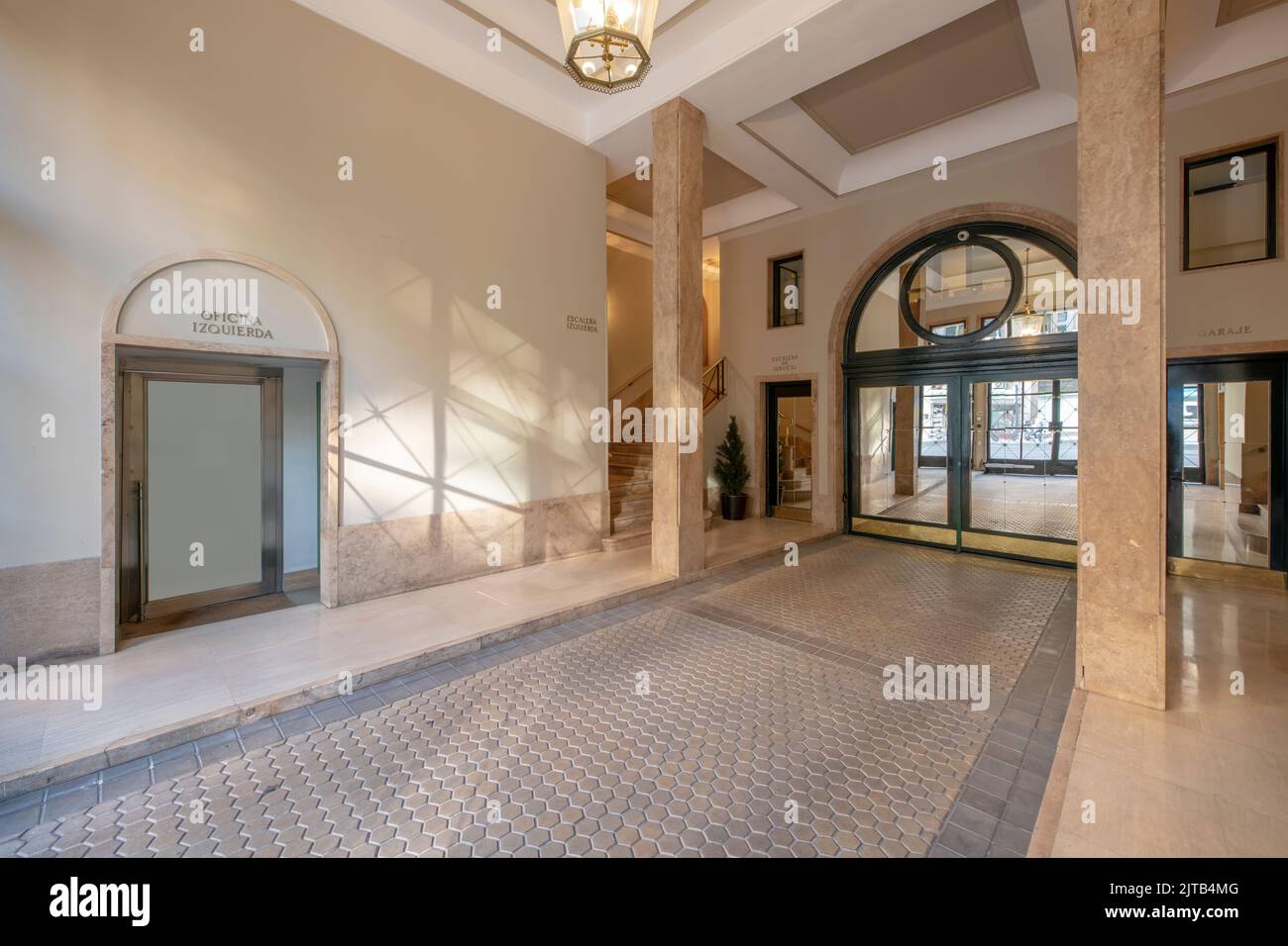 Stately portal of a house with doors with semicircular arches, light ...