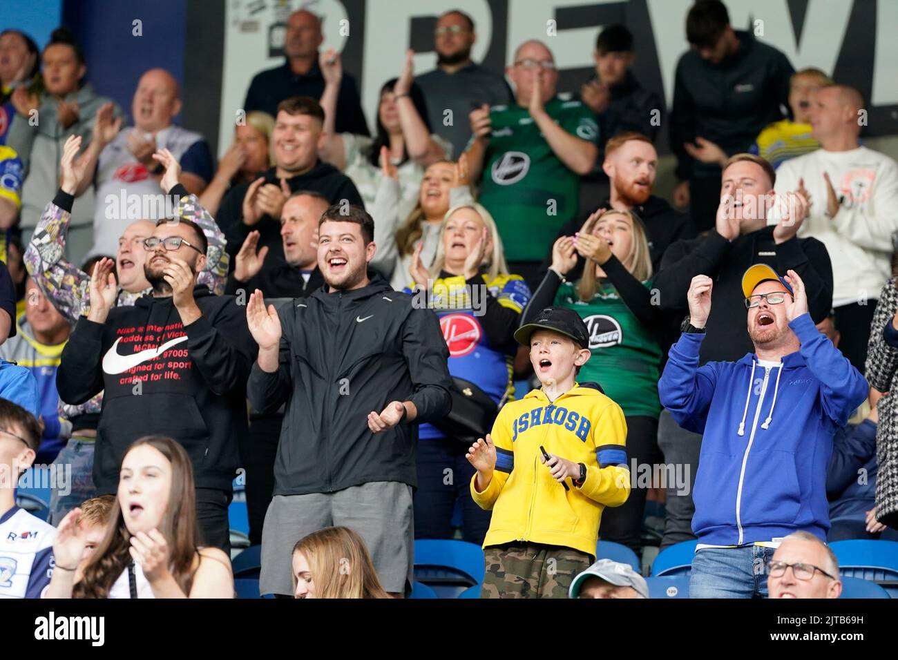 Warrington Wolves fans cheers their players after a late comeback fell ...