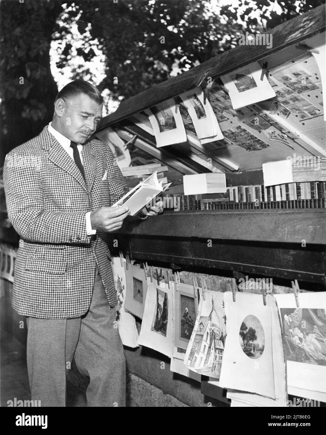 CLARK GABLE at one of the Book Stalls along the River Seine in Paris in ...