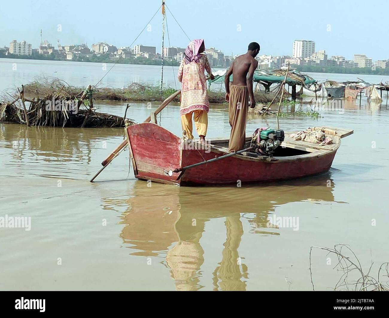 Sukkur, Pakistan, August 29, 2022. People are using boats for ...