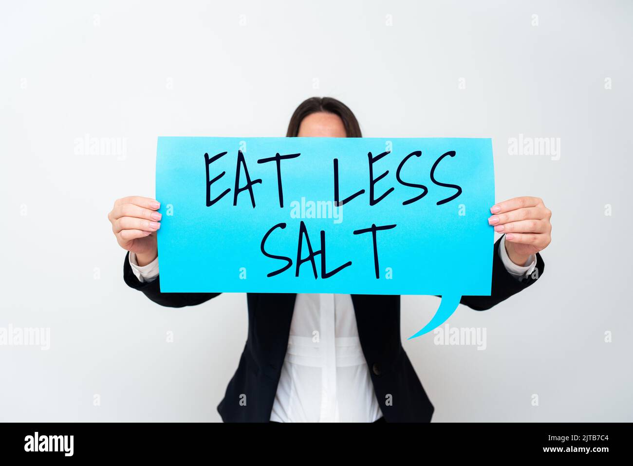 Sign displaying Eat Less Salt, Business showcase Reduce the amount of ...
