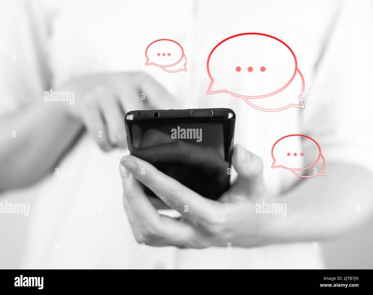 Woman holding phone for responding to negative comments. Black and ...