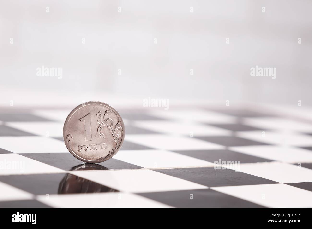 1 Russian ruble on a chessboard. Game of currencies on a chessboard ...