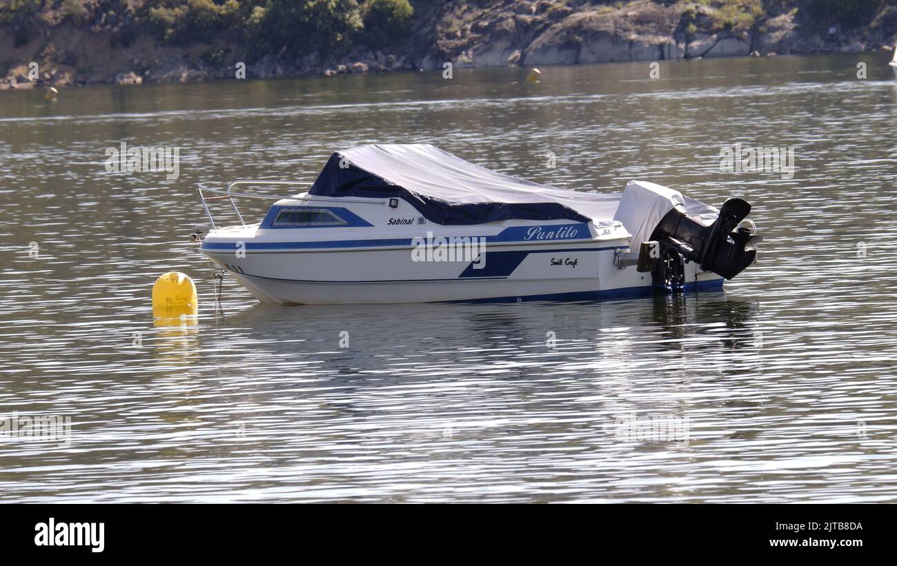 The boats sailing in a lake in San Juan reservoir, Madrid Stock Photo ...