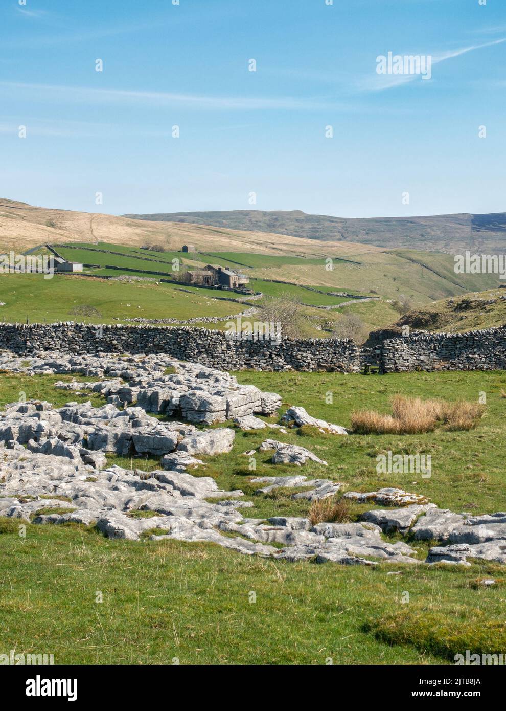 Views across limestone pavement towards Pen-Y-Ghent House Farm, Halton ...