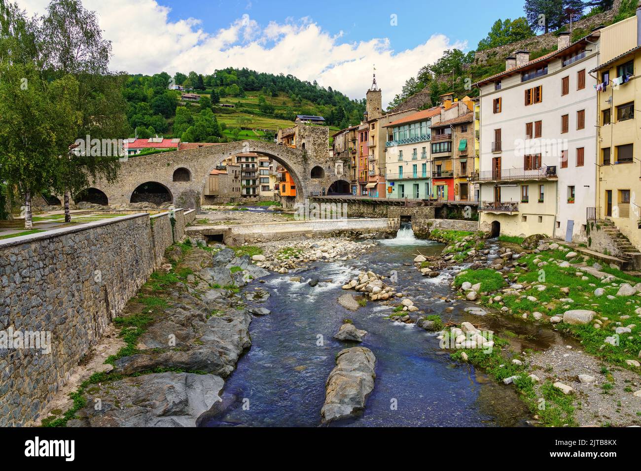 River Ter as it passes through the medieval village of Camprodon with ...