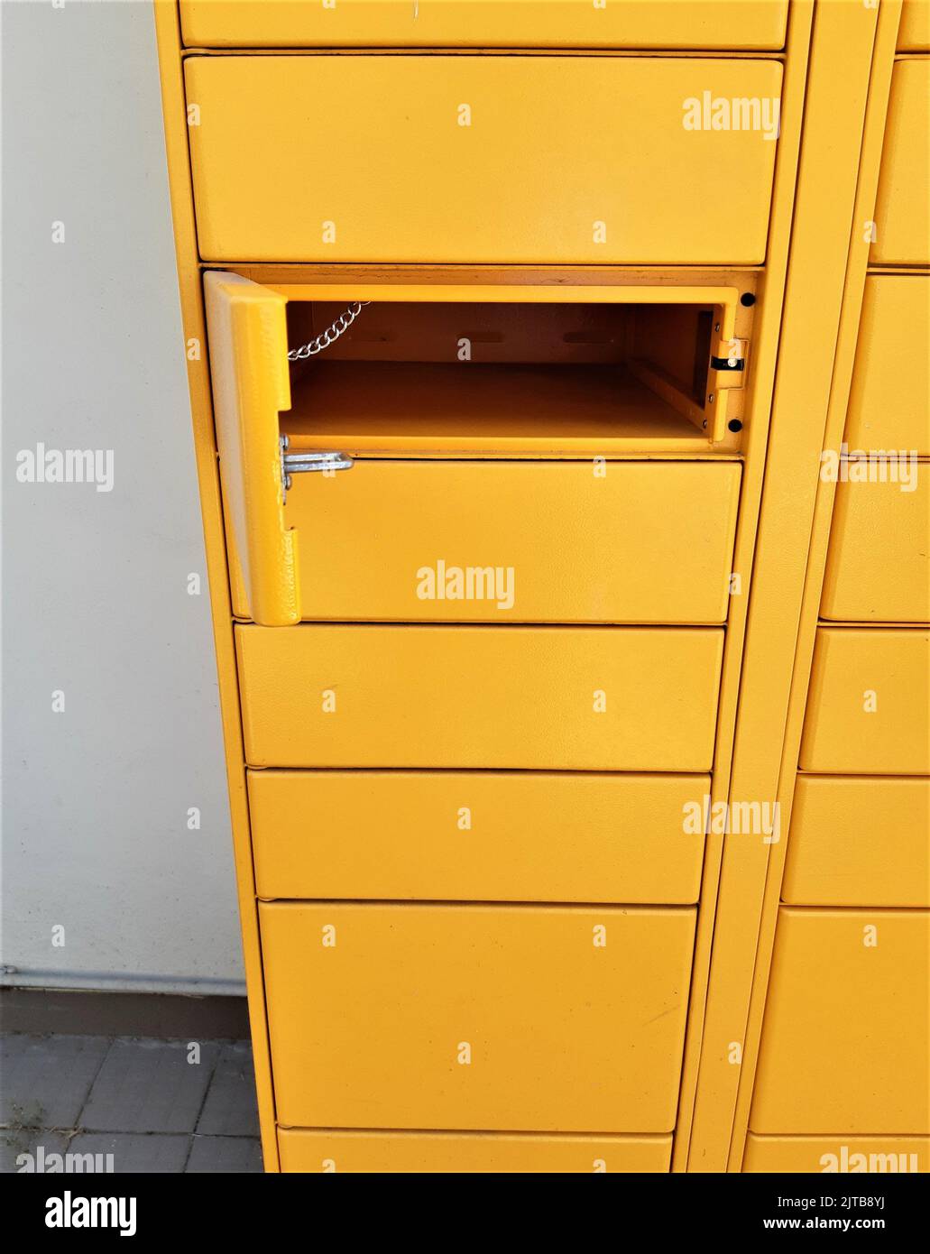 Self service storage cabinet for picking up a package in a city area ...