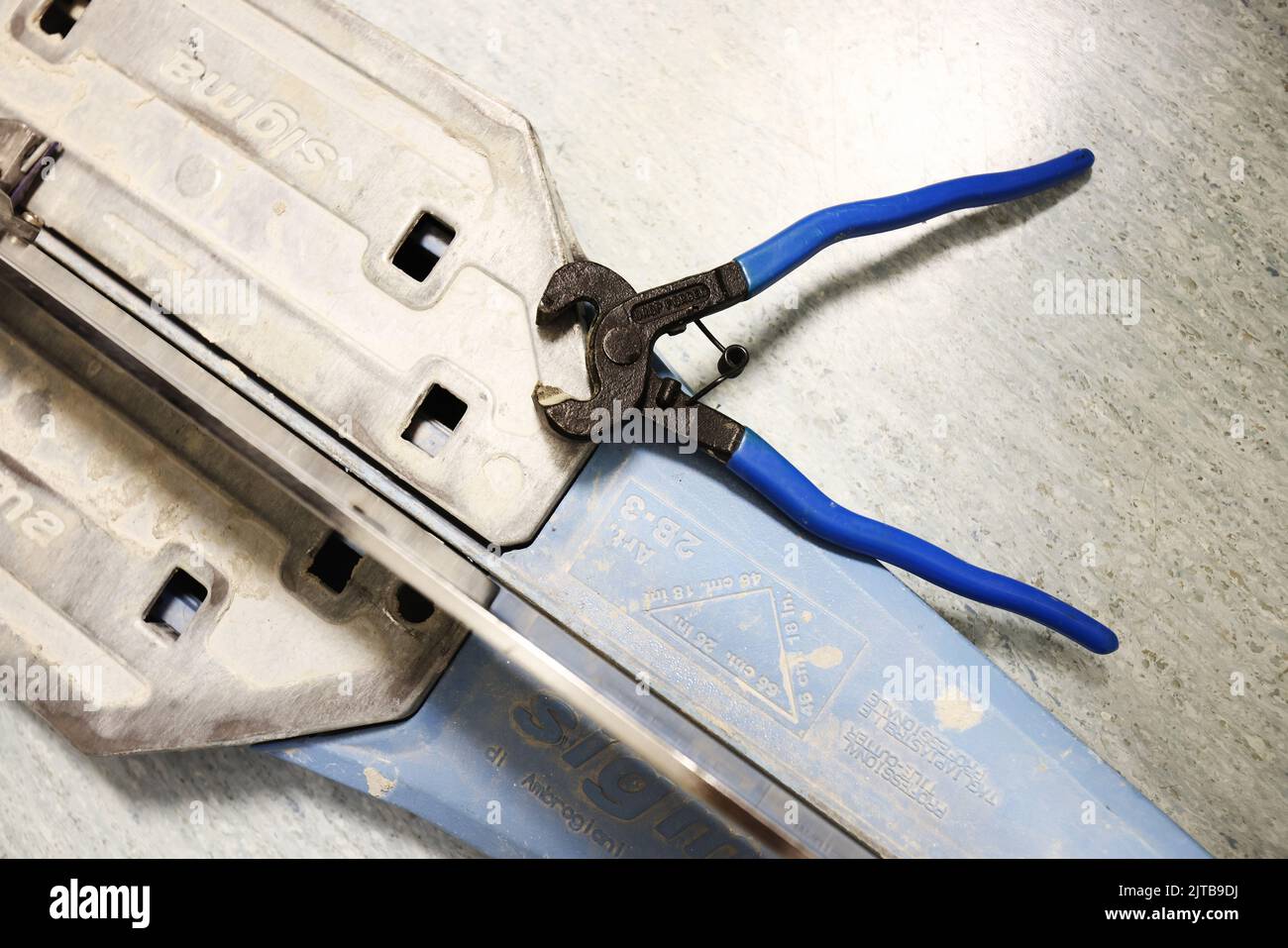 Tools for a craftsman to set tiles in a bathroom Stock Photo - Alamy