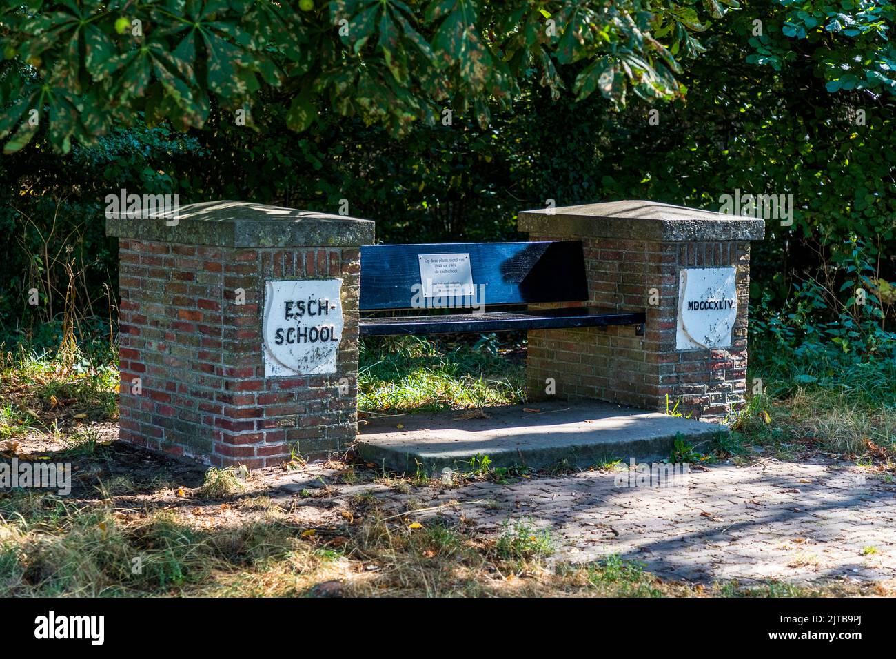 Solid brick park bench commemorating the Esch School in Delden ...
