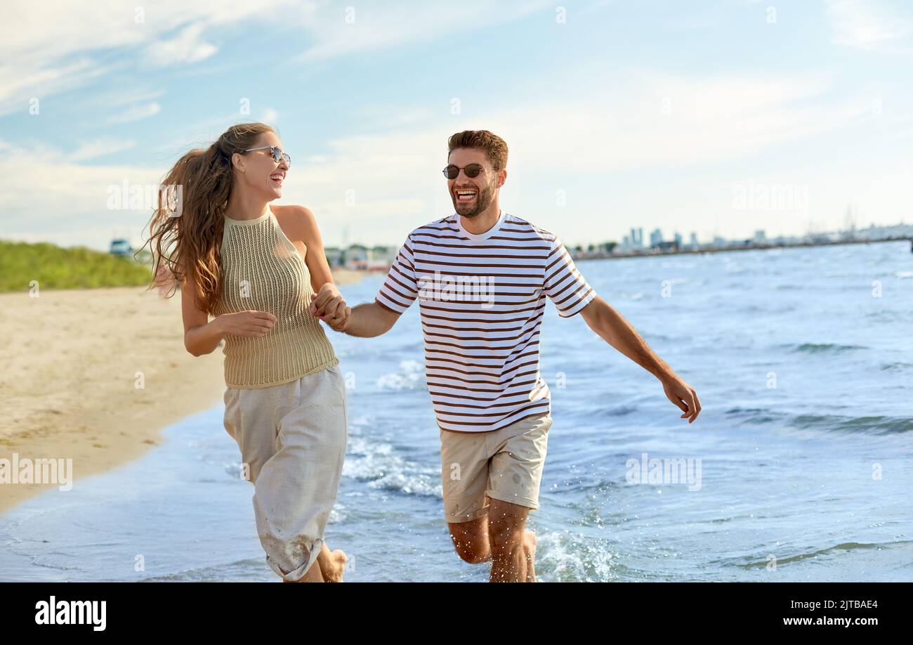 Man woman running young laughing hi-res stock photography and images ...