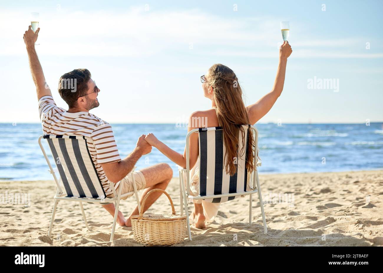 happy couple drinking champagne on summer beach Stock Photo - Alamy