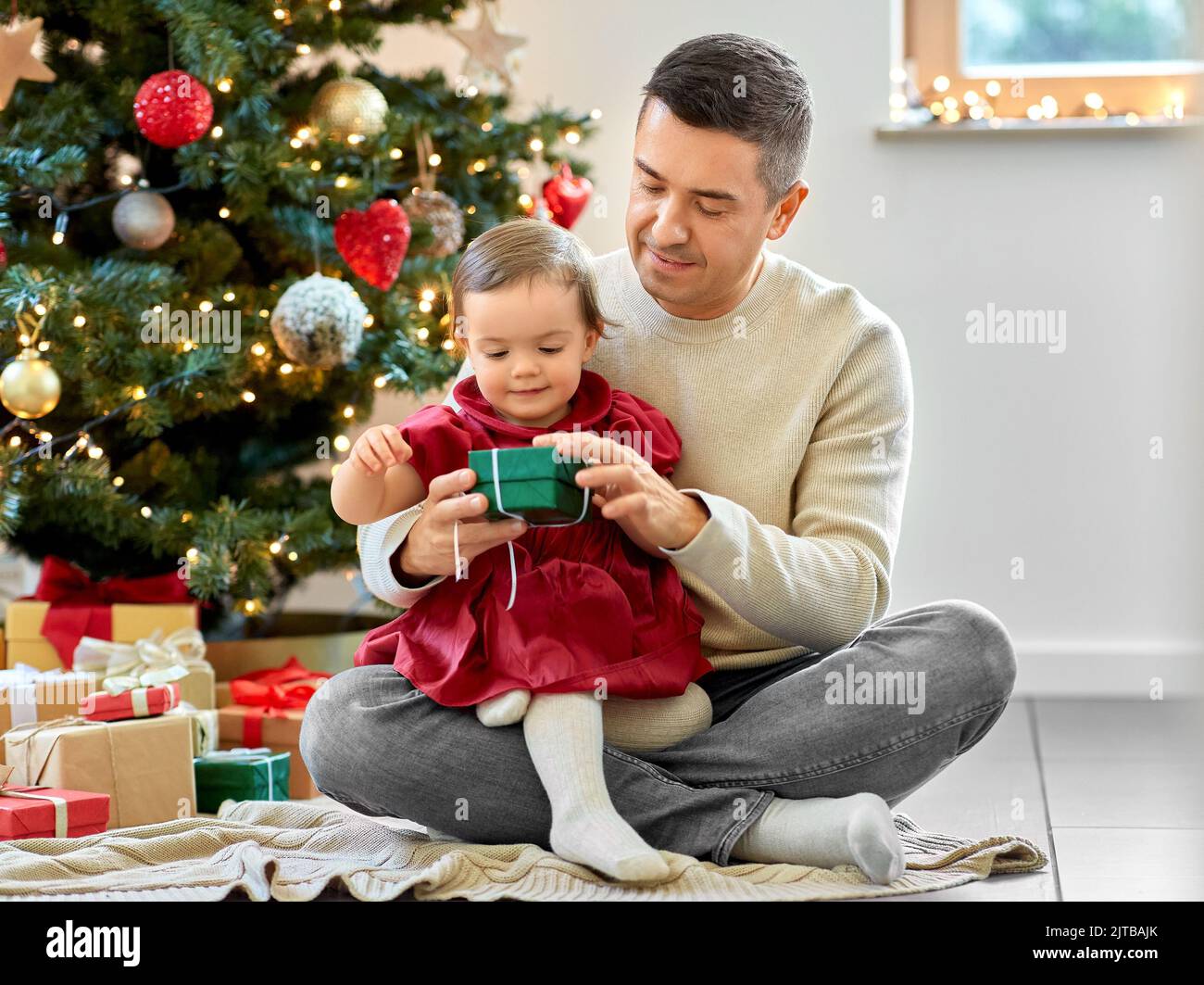 happy father and baby daughter on christmas Stock Photo - Alamy
