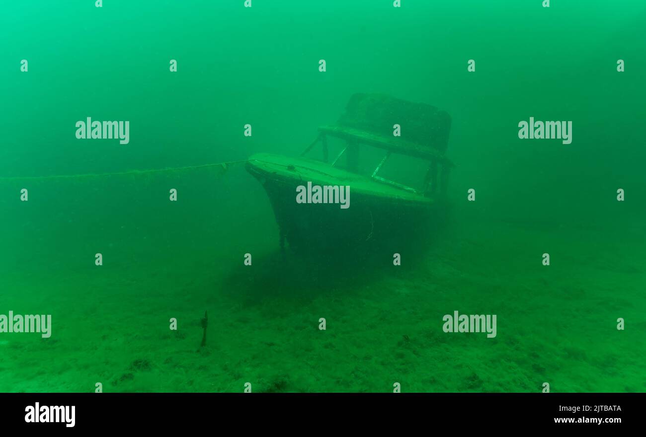 Gloomy underwater wreck of recreational speed boat Stock Photo - Alamy