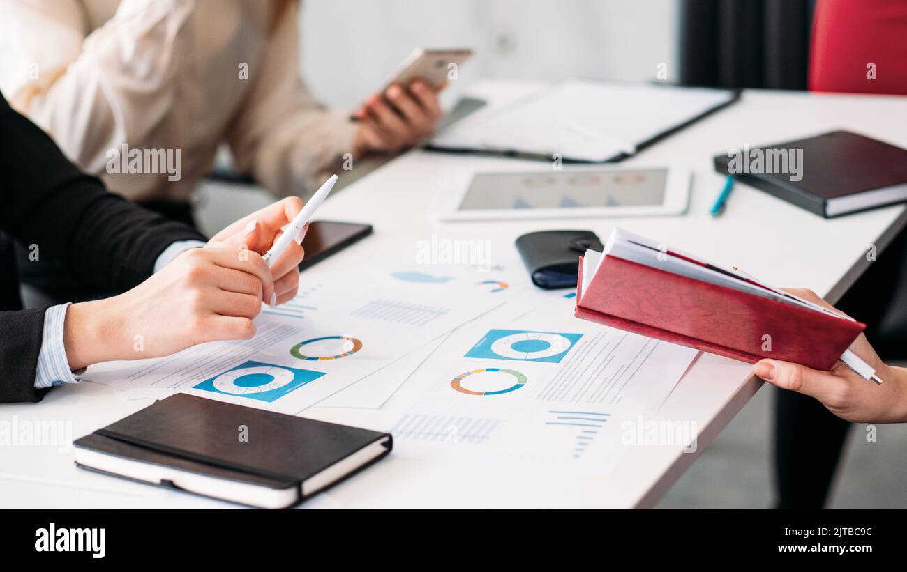 sale analysis business meeting workplace paperwork Stock Photo - Alamy