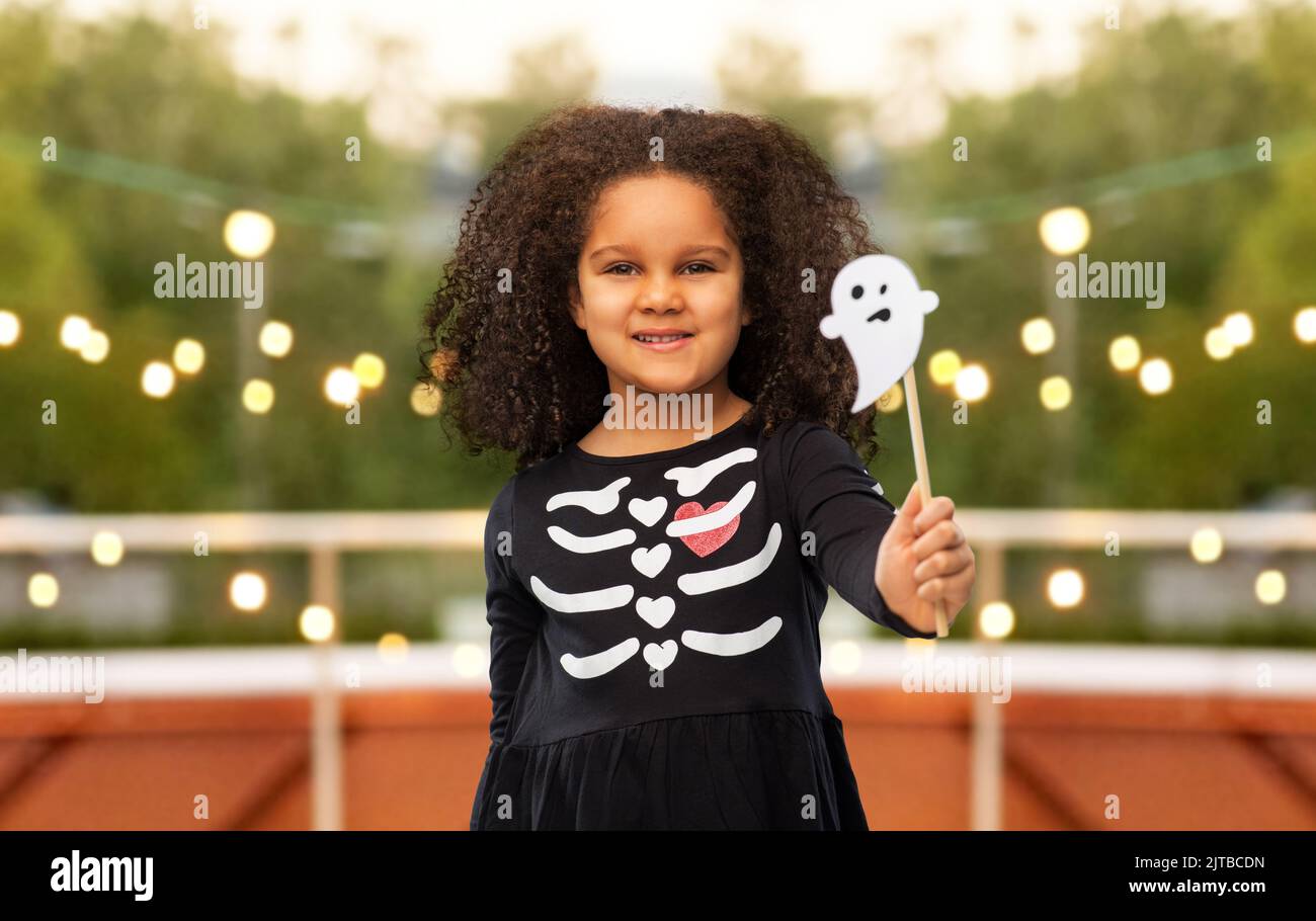 girl in black halloween dress with skeleton bones Stock Photo - Alamy